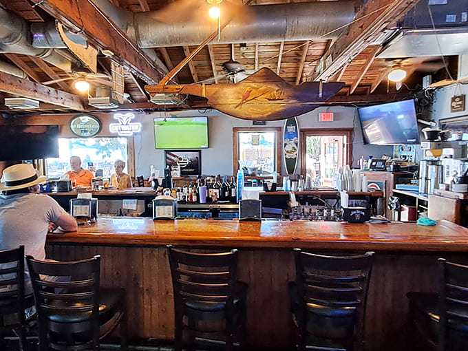 Another angle reveals the full scope of this welcoming bar, where regulars and newcomers alike find their spot and settle in happily.