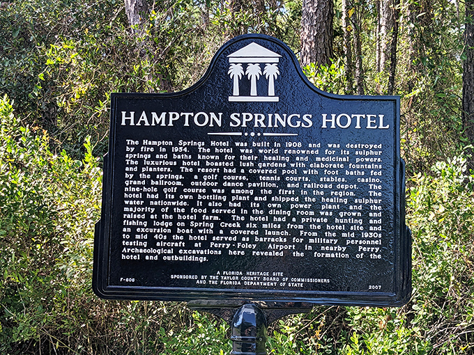 History preserved in black and white &ndash; the plaque offers a glimpse into the hotel's glamorous past before fire claimed its grandeur.