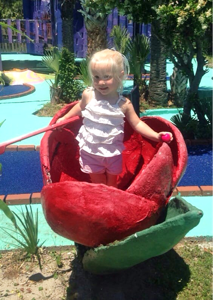 Nature meets whimsy in this oversized bloom, offering a perfect photo opportunity for pint-sized putters.