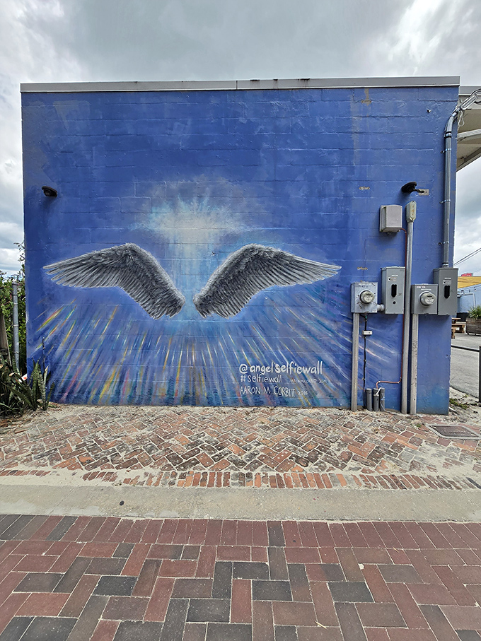 Nearby, an angel wing mural offers a heavenly counterpoint to the dragon's more infernal aesthetic &ndash; perhaps suggesting a balance between the divine and the draconic.