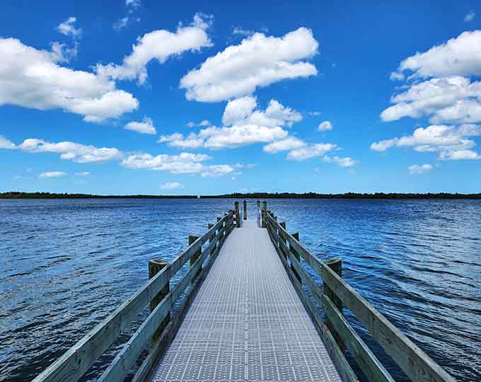 This fishing pier extends into the Indian River like a wooden finger pointing toward adventure, dinner, or both if you're lucky.