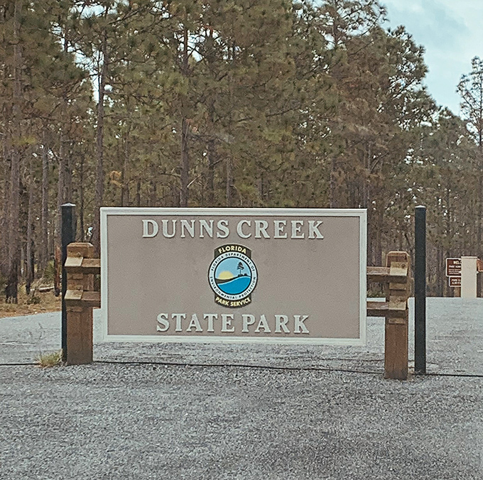 The park entrance sign promises 6,200 acres of authentic Florida experiences without a single gift shop.