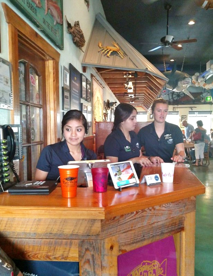 The front-of-house crew ready to guide you through the day's catch &ndash; seafood sommeliers in casual Florida style.