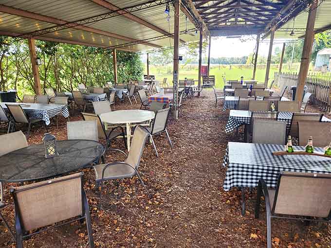 The covered outdoor dining area offers shade, breeze, and vineyard views for the perfect tasting experience.