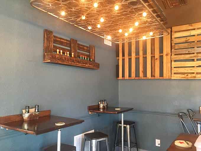 Metal chairs and dark wood tables create a space that's perfect for everything from solo lunches to group gatherings with friends.