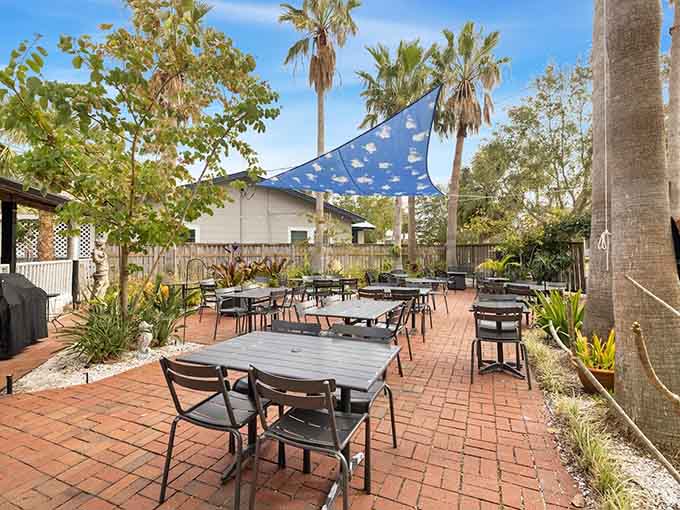 Outdoor dining under the palms lets you enjoy fresh Gulf seafood while the breeze reminds you why people fell in love with Florida originally.