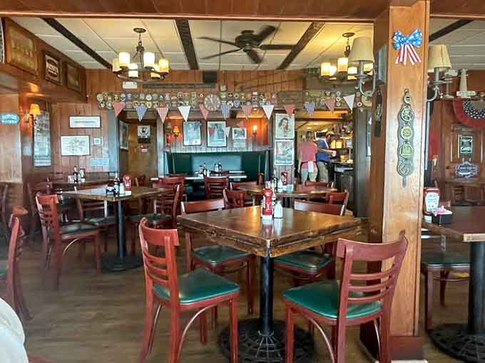 Another angle reveals more of that warm, woody interior where nautical decor and comfortable seating make lingering feel mandatory, not optional.