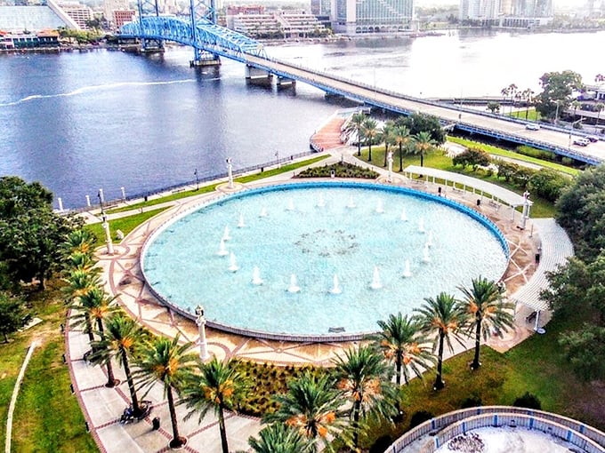 From above, the fountain's perfect circular basin resembles a blue jewel set within a necklace of palm trees along Jacksonville's riverfront.