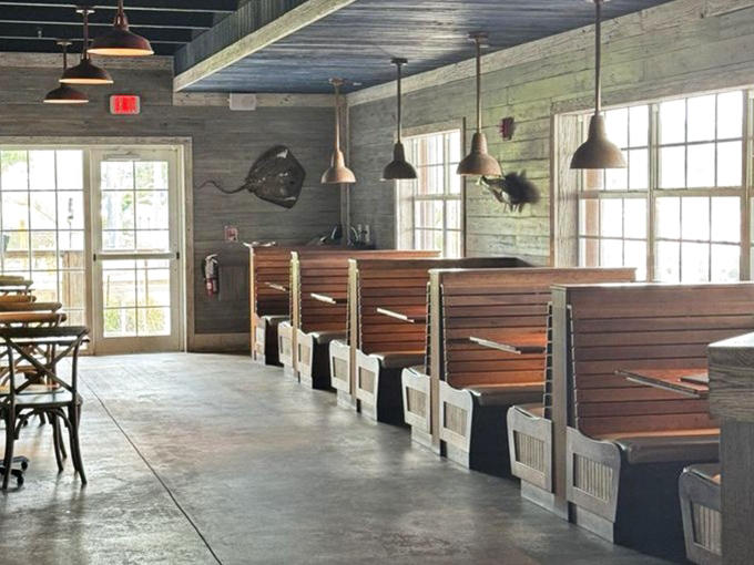 Cozy booth seating offers the perfect perch for watching boats glide by while savoring the catch of the day.