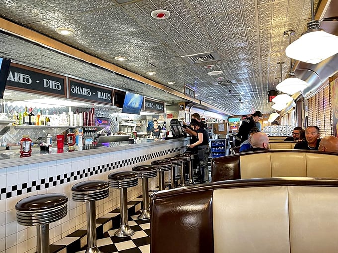 The counter offers front-row seats to culinary theater, where short-order cooks perform their sizzling symphony with the confidence of Broadway veterans.