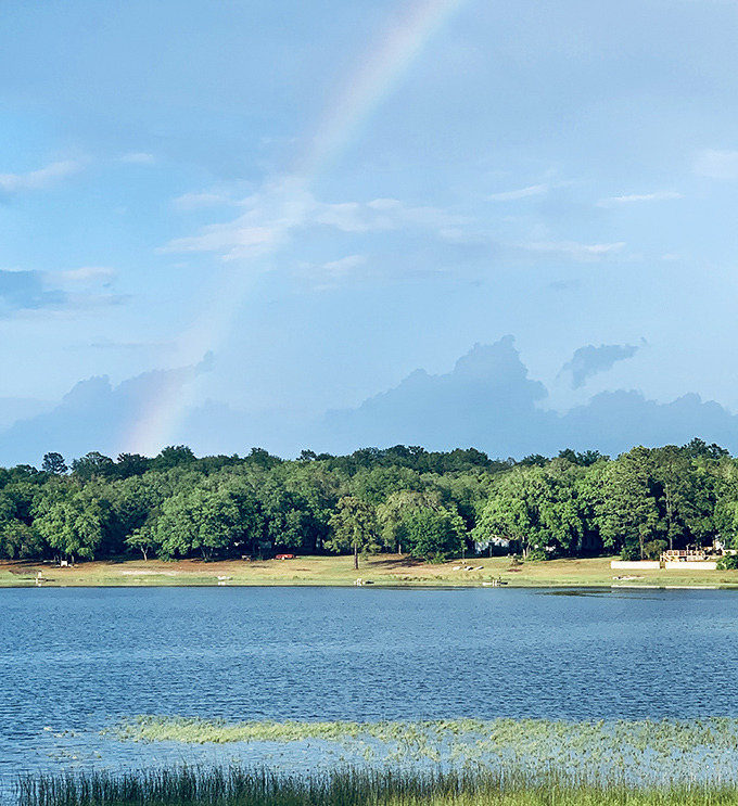 Nature's own light show &ndash; a rainbow arcs over Lake Santa Fe's green shores, as if the universe decided this view wasn't quite perfect enough already.