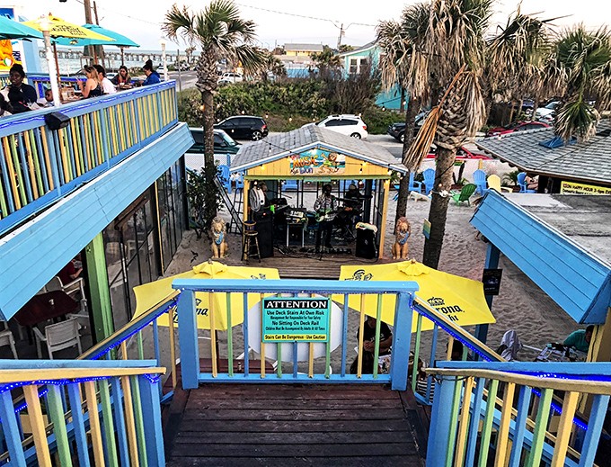 Live music fills the air as guests enjoy the outdoor stage area &ndash; where local talent provides the soundtrack to perfect beach days.
