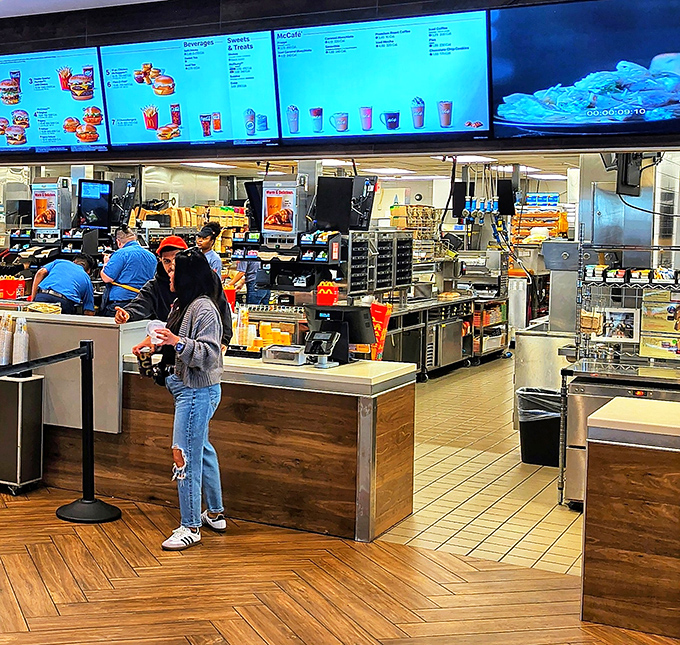 The ordering counter blends fast-food efficiency with upscale touches – note the wood accents and modern design elements throughout.