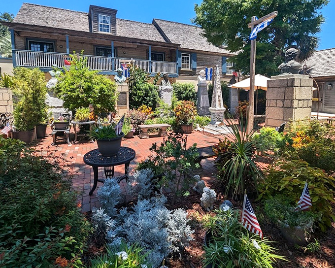 A peaceful garden surrounds the schoolhouse, offering a lush contrast to the spartan educational environment waiting inside.
