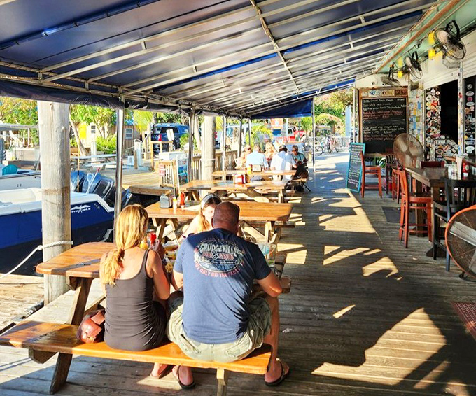 Dockside dining at its finest, where the gentle rocking of boats provides the perfect rhythm for leisurely meals and lazy conversations.