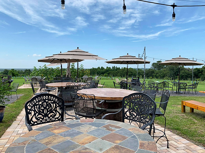 The patio's thoughtful design blends rustic elements with comfortable seating, creating spaces that encourage lingering long after your tasting ends.