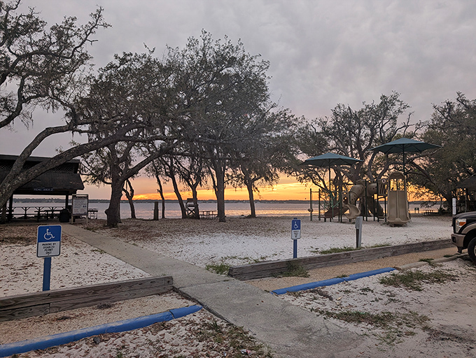 Sandy shores meet oak-dappled sunlight at the bayou's edge &ndash; Florida's natural playground without the admission price.