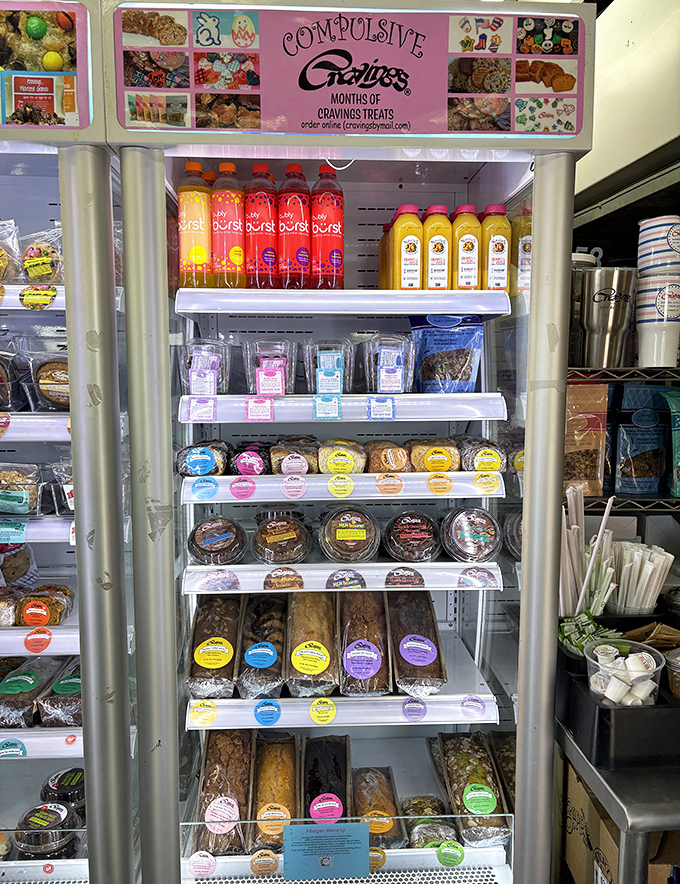 The refrigerated display case – a temperature-controlled museum of edible art where impulse purchases become inevitable life decisions.