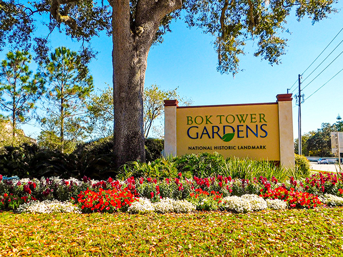 The Bok Tower Gardens sign stands amid a floral welcome committee that's clearly overachieving at its job of first impressions.