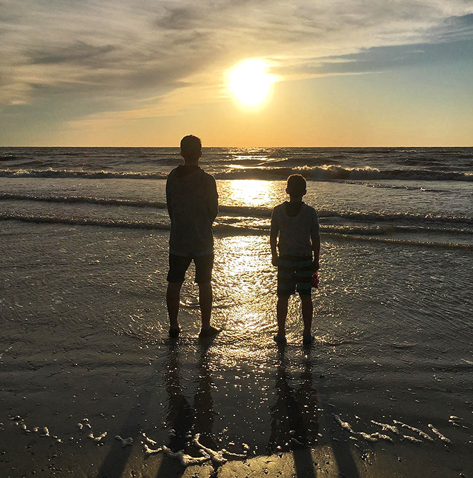 Silhouettes against a golden sunset create the kind of moment that makes you forget to check your phone.