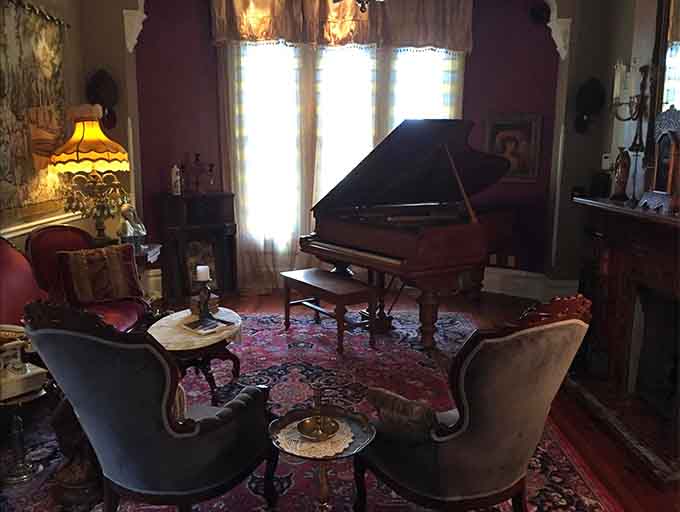 Colorful stained glass borders transform ordinary windows into works of art, creating the perfect backdrop for the inn's collection of vintage treasures.