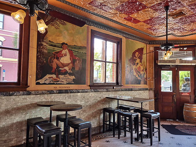 Vintage murals watch over patrons like benevolent spirits, including "Mr. Pickwick" whose eyes seem to follow you after your second drink.