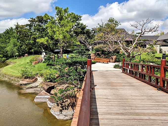 This red bridge over the pond is where koi fish go to show off for visitors.