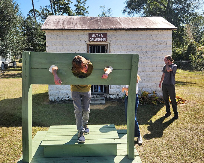 Young visitors get a taste of frontier justice in the stocks outside the Altha Calaboose &ndash; punishment that makes losing screen time seem mild.
