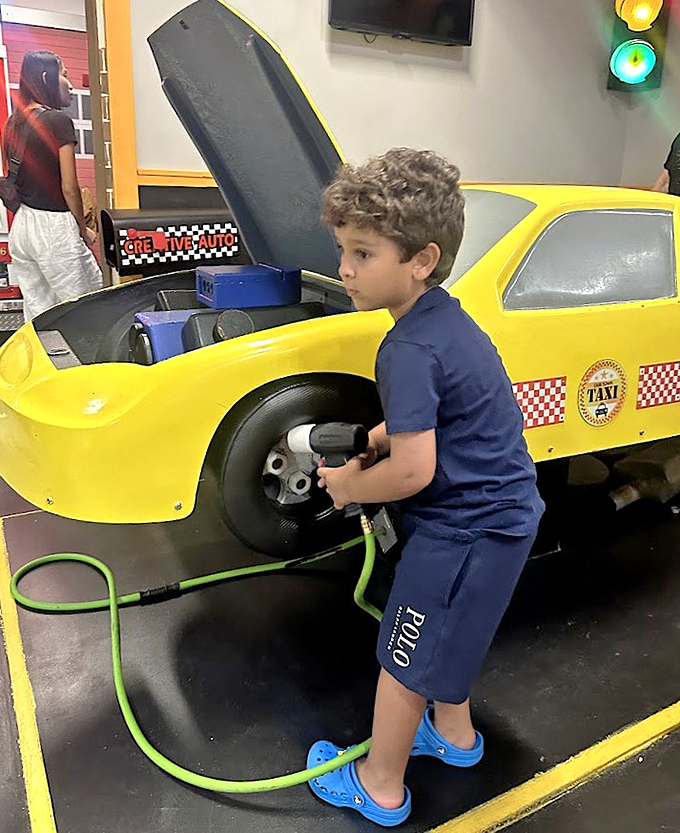 Junior mechanics tackle automotive challenges with concentration that would impress any certified technician at this taxi repair station.