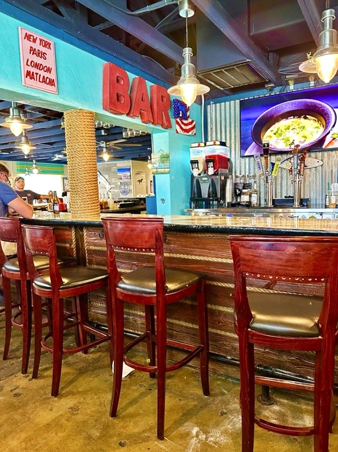 The bar's nautical touches and "New York, Paris, London, Matlacha" sign remind you that great food transcends geography.