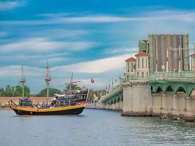 Passing under the bridge, the ship reminds everyone that St. Augustine's waters have seen centuries of maritime history, and you're now part of it.