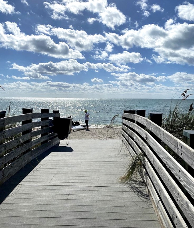 Gateway to bliss: The wooden boardwalk creates that perfect transition moment between everyday life and barefoot beach escape.