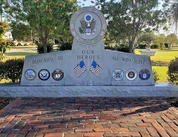 The memorial wall honors all who served, each name representing someone's father, brother, son, or friend who answered the call.