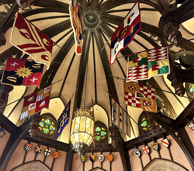 Look up to discover a canopy of medieval banners and crests, creating an atmosphere that would make any history buff swoon.