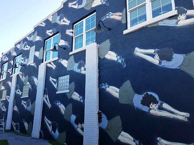 This swimming-themed mural captures movement and grace, reminding you that Florida's relationship with water extends beyond just beach tourism and hurricane prep.