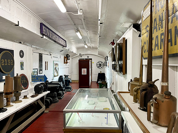This narrow corridor once bustled with conductors and passengers, its walls now lined with artifacts telling stories of the people who made the railroads run.