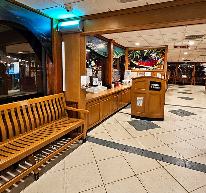 The welcoming entrance area sets the tone for the unpretentious seafood feast that awaits beyond those wooden doors.