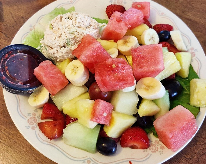 The fruit plate that puts hotel continental breakfasts to shame. Fresh, vibrant, and paired with what appears to be perfect tuna salad.