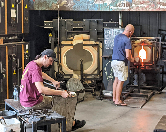 Behind the magic: skilled artisans work with molten glass in the demonstration area, revealing the intense process behind each finished piece.