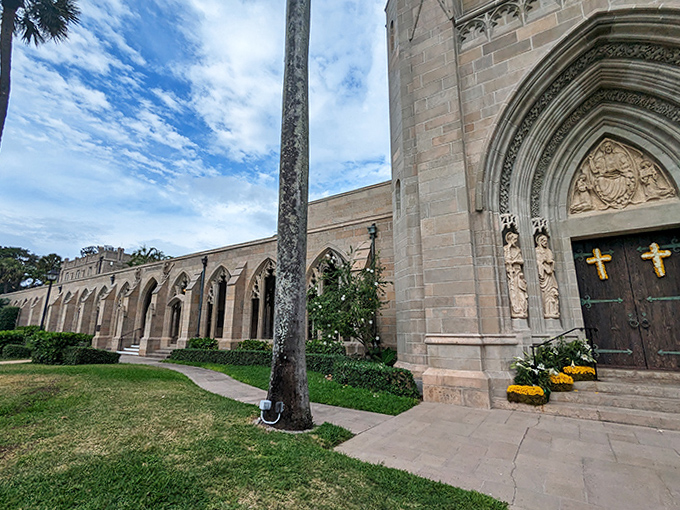 The church's exterior walkway combines strength and grace, where massive stone walls are softened by climbing vines and Florida's eternal summer.