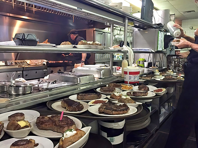 The kitchen line moves with choreographed precision, each plate a performance piece in this culinary concert that's been running for decades.