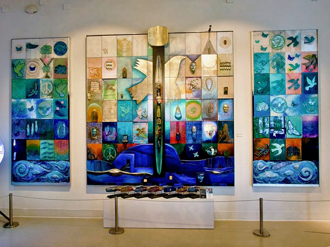 This massive glass panel installation combines hundreds of individual pieces into a cohesive story, like pages from an illuminated manuscript.