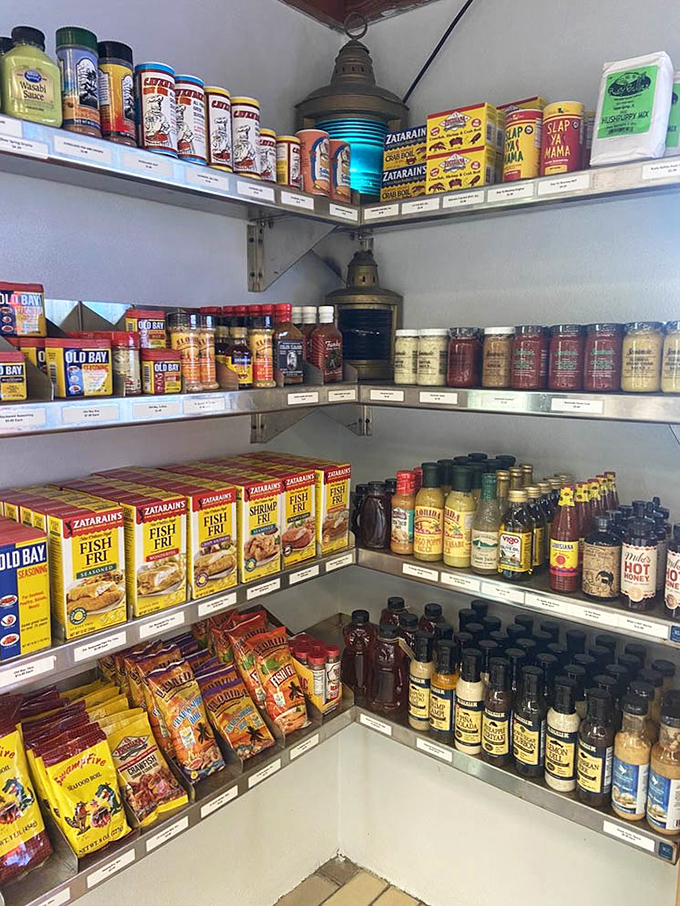 A cook's dream pantry corner stocked with Zatarain's, Old Bay, and hot sauces &ndash; the secret weapons behind those flavors.
