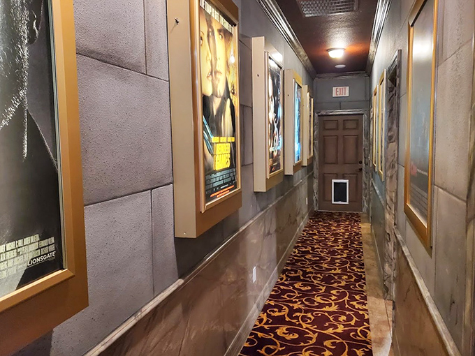 This movie theater hallway makes walking to your room feel like a red carpet event, though the popcorn is thankfully not stuck to the floor.