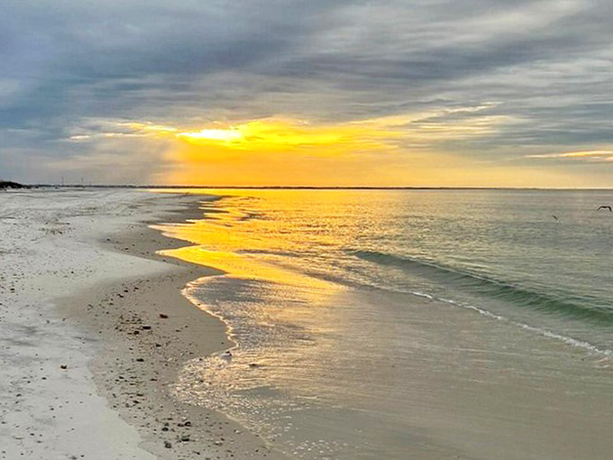 The meeting place of sky and sea creates a horizon so perfect it seems drawn with a ruler dipped in watercolors.