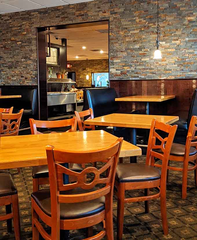 Cozy booths and warm lighting create an atmosphere where lingering over coffee feels not just acceptable but encouraged.