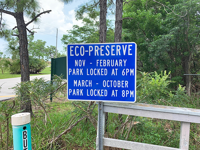 Even paradise has closing times – this sign ensures visitors plan accordingly for their mangrove forest adventure.