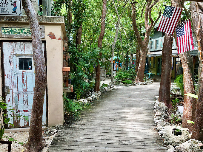 Nature and commerce intertwine along this weathered wooden pathway, where shopping becomes an adventure through a tropical forest.