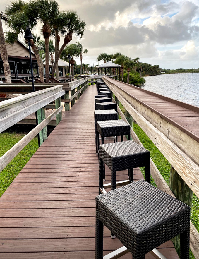 The wooden boardwalk invites diners to find their perfect perch along the water, where every seat comes with a side of spectacular views.