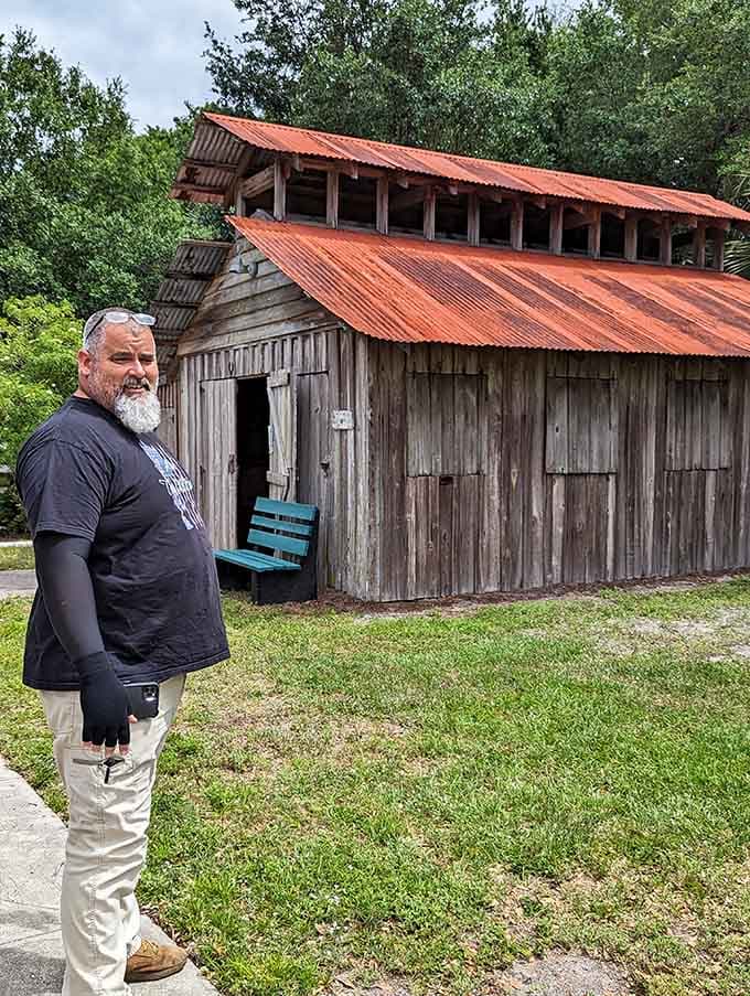A visitor pauses by the historic structure, contemplating life before air conditioning and wondering how anyone survived Florida summers back then.